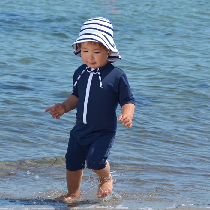 Noe BASIC UV-sunsuit S/S - blue - Petit Crabe