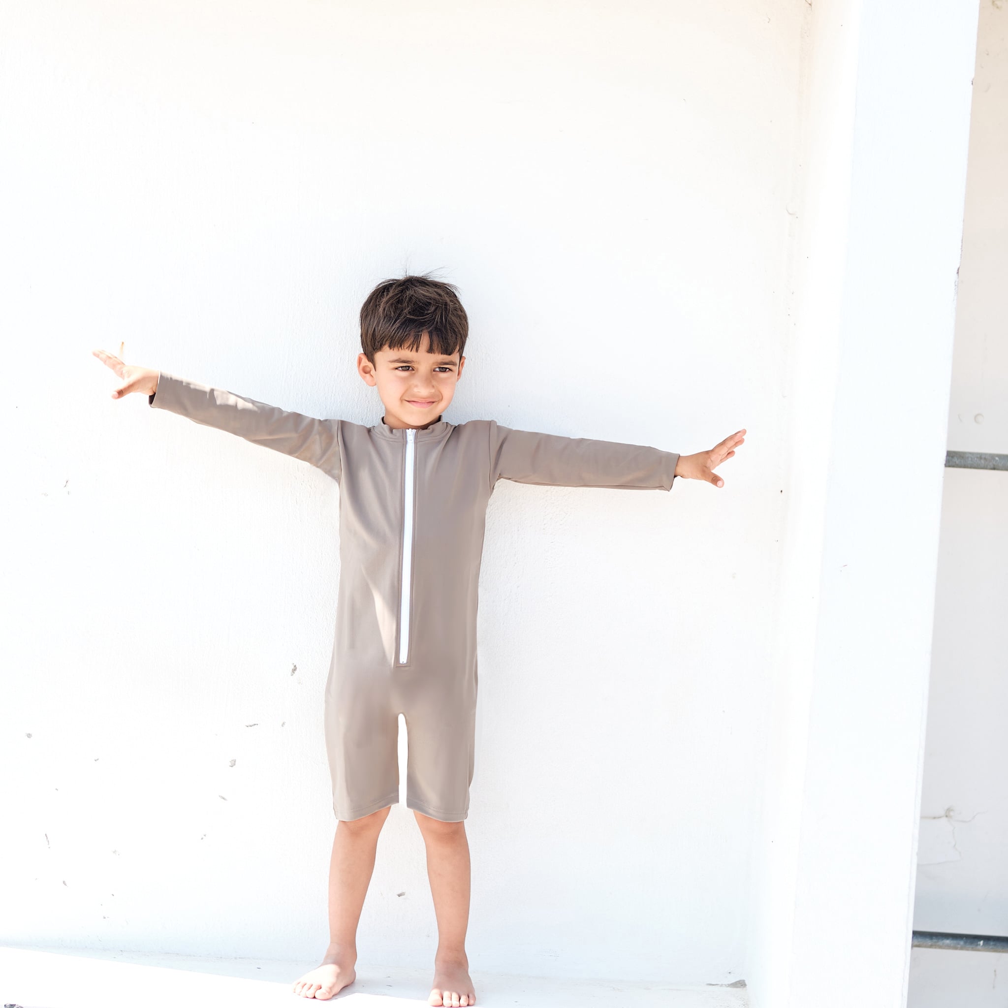Combi Sunsuit - taupe - Petit Crabe